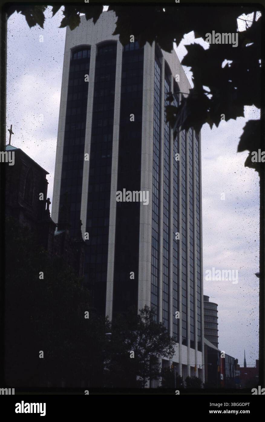A color photograph of the Midland Building, a 21-story white high-rise ...