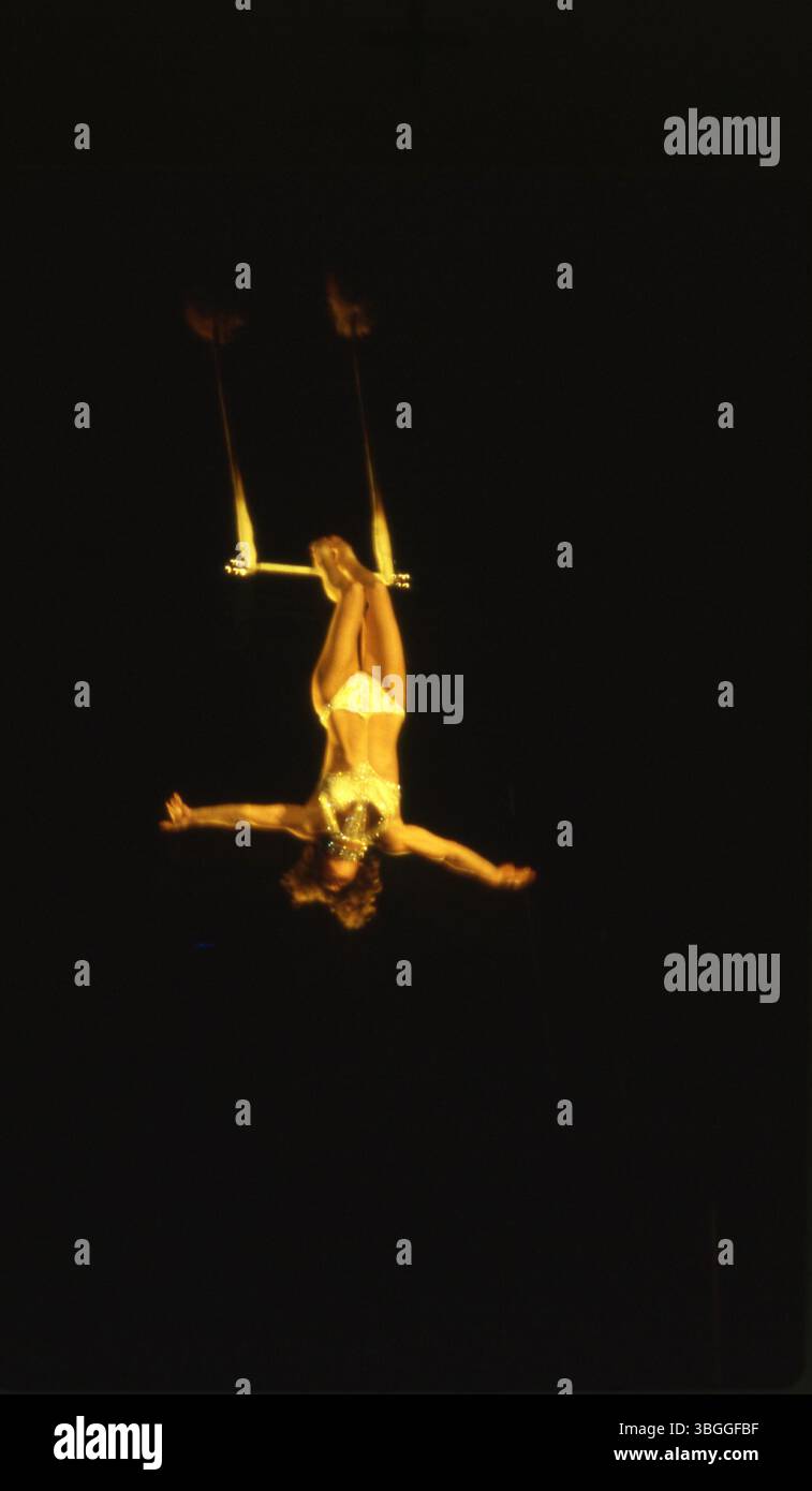 Female trapeze artist performs upside down at the 1979 Aladdin Shrine ...