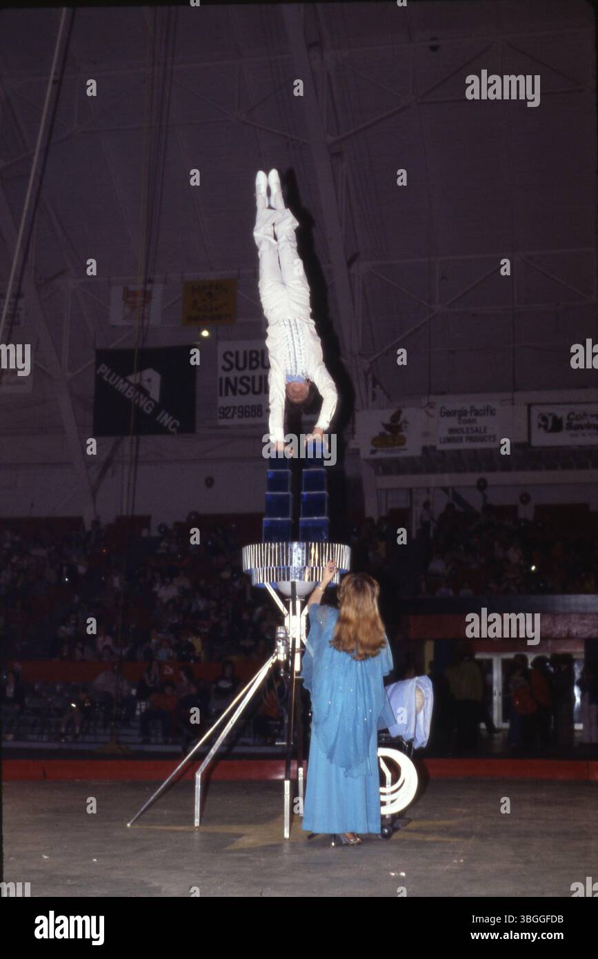 A male acrobat from the 29th annual Aladdin Shrine Circus, balancing ...