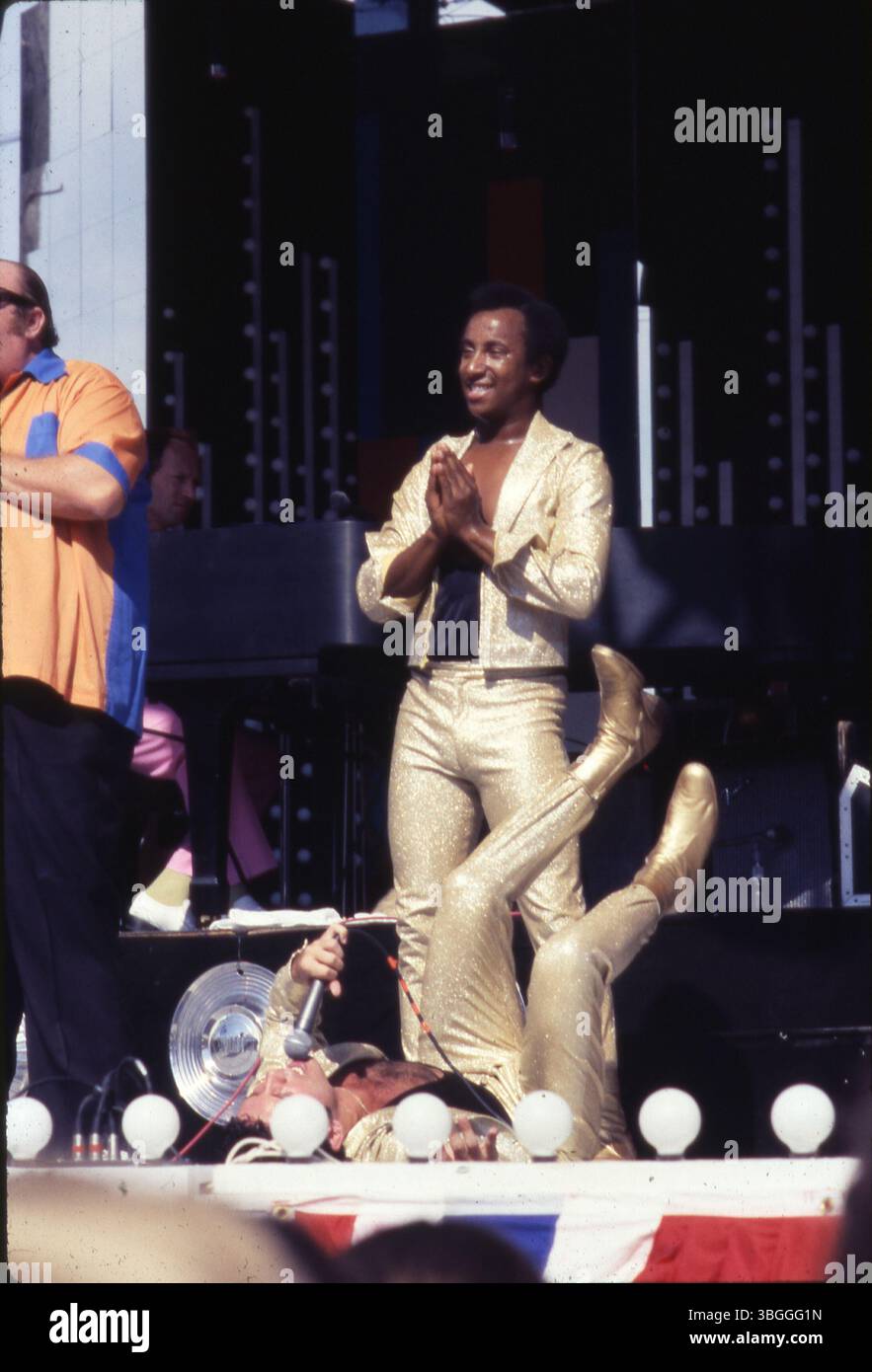 Sha Na Na band member Denny Greene, dressed in gold lame, performs at ...