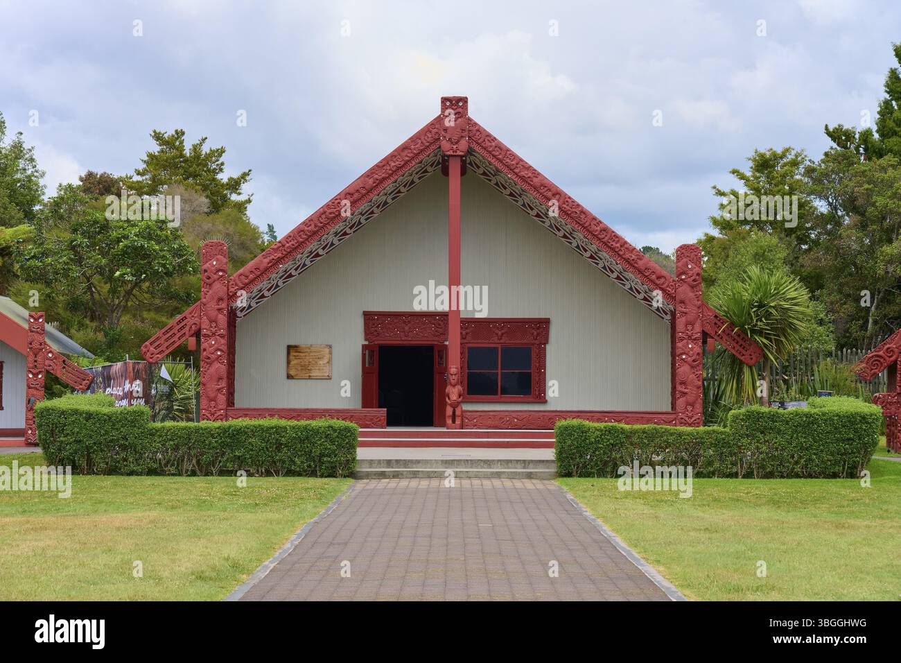 Maori meeting house with red decorations in traditional style, New ...