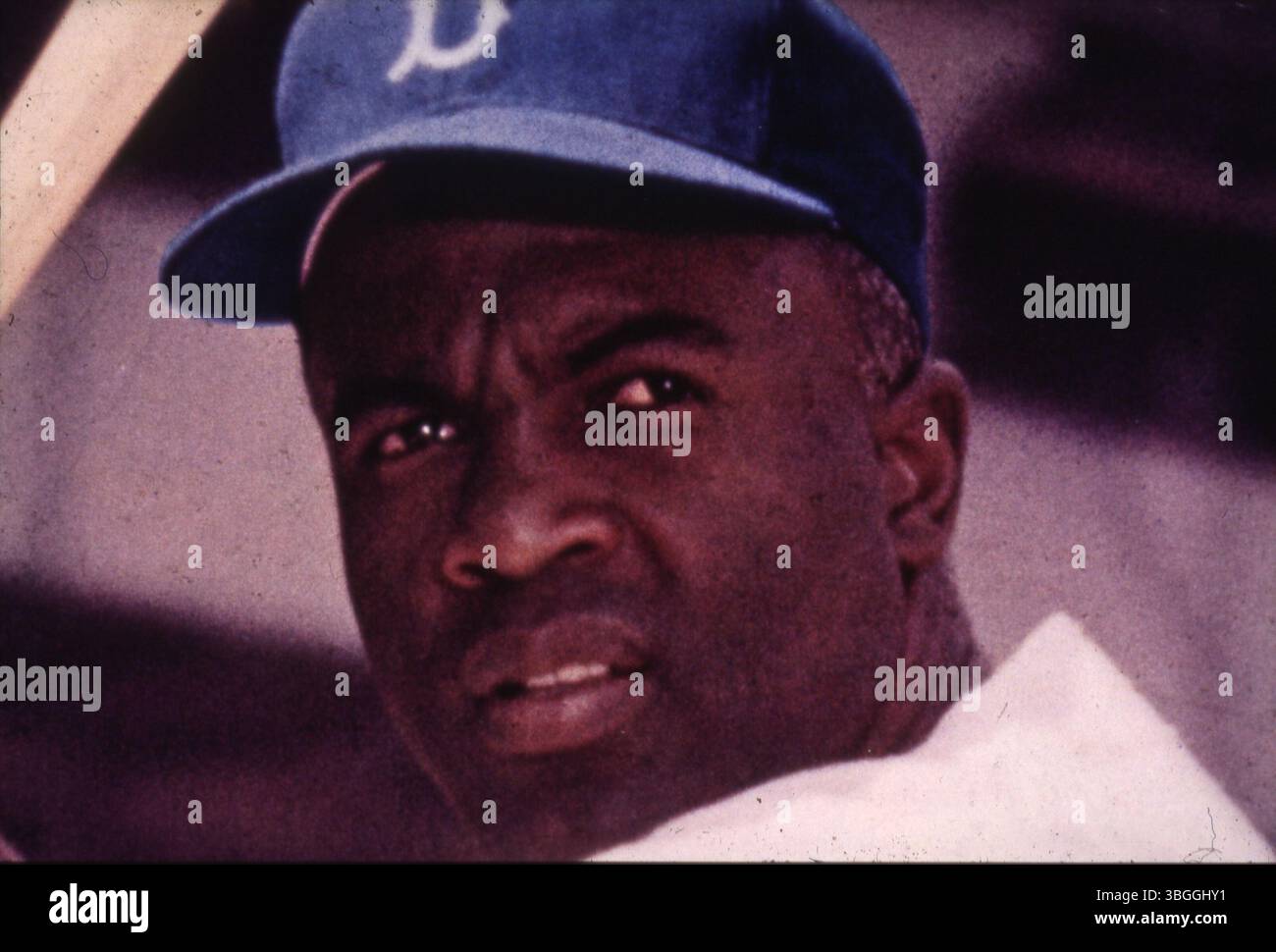 Poster image of Jackie Robinson holding a bat and wearing a Brooklyn ...