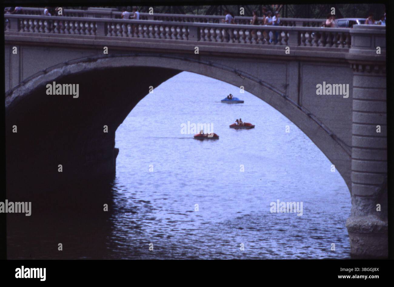 Three pedal boats are visible on the Scioto River in 1986, seen through ...