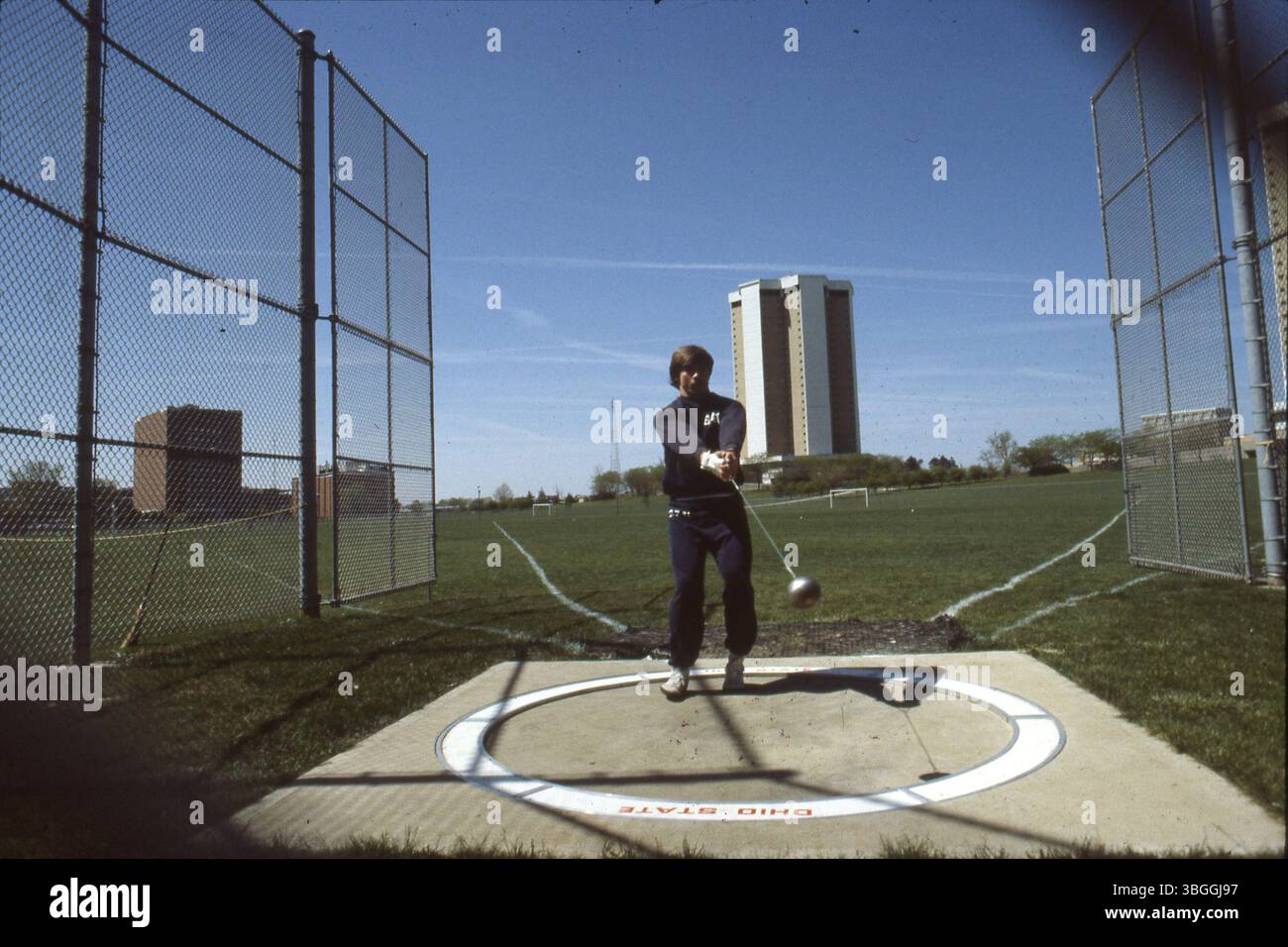 An Ohio State University student practices the hammer throw on campus ...