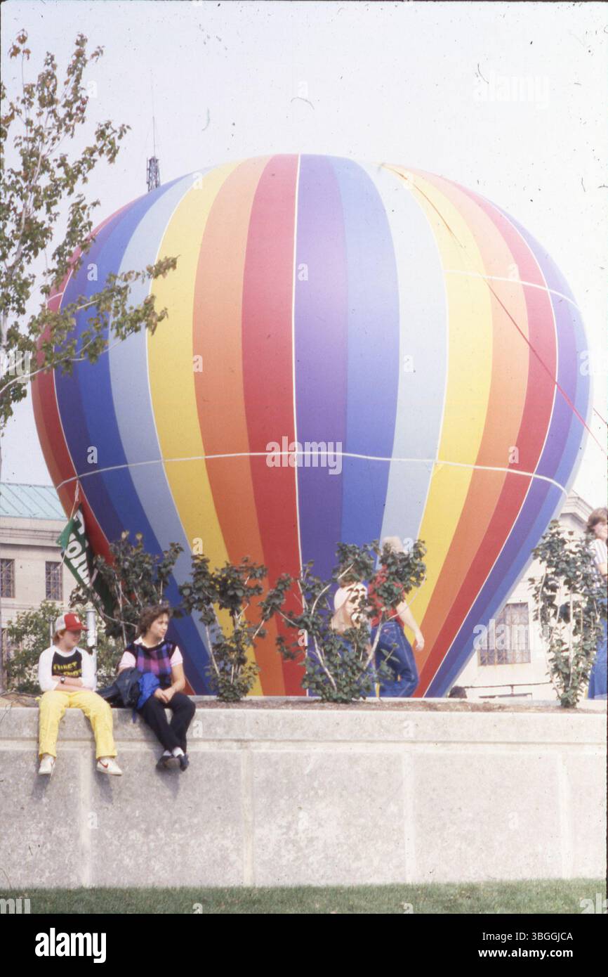 In 1986, a multi-colored striped hot air balloon is seen at Battelle ...