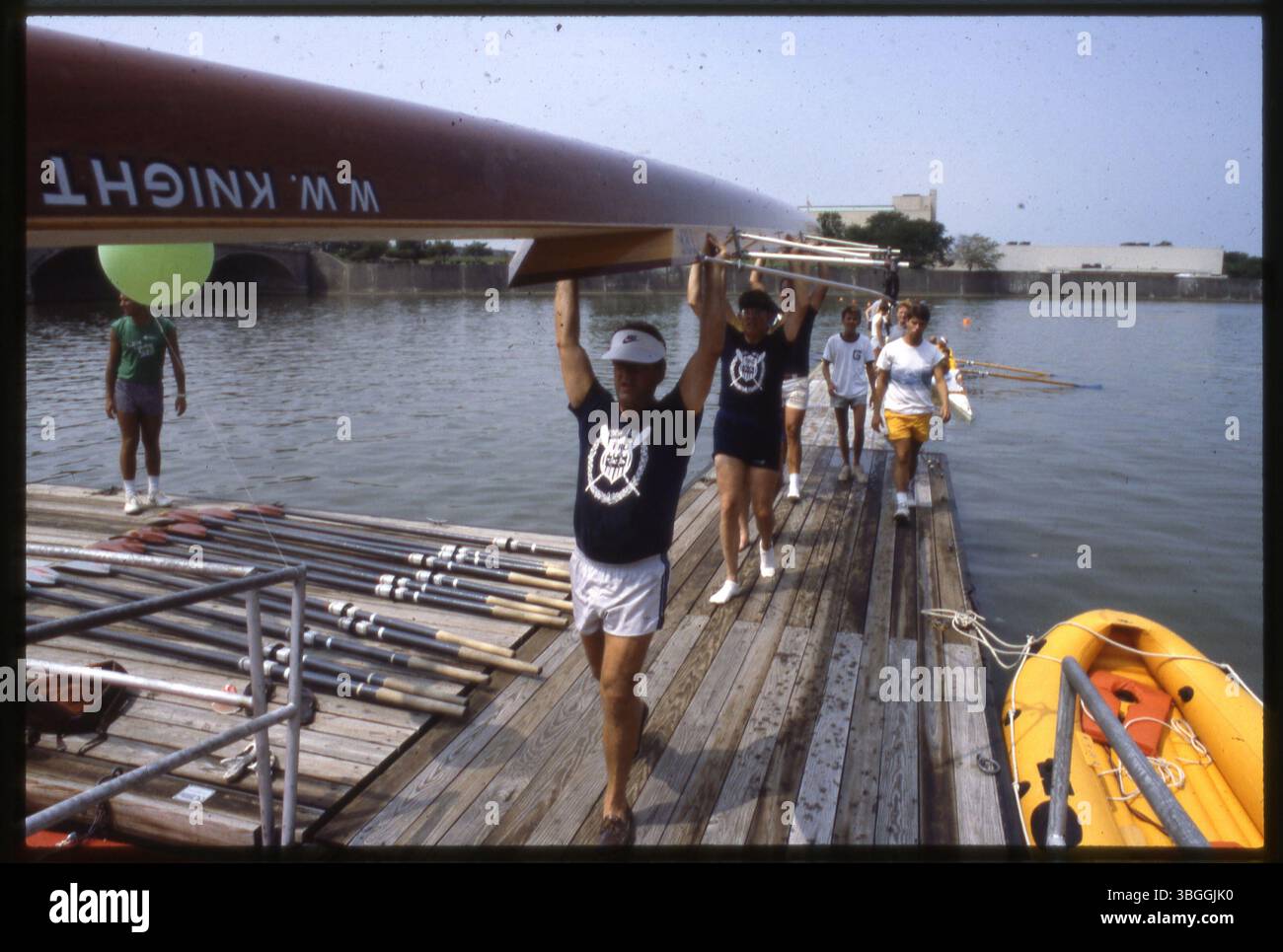 Members of the Toledo Rowing Club carry their racing shell, named W.W ...