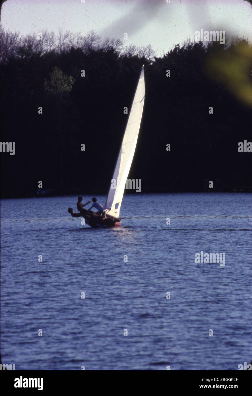 Three boaters maneuver their sailboat along the Scioto River in 1979 ...
