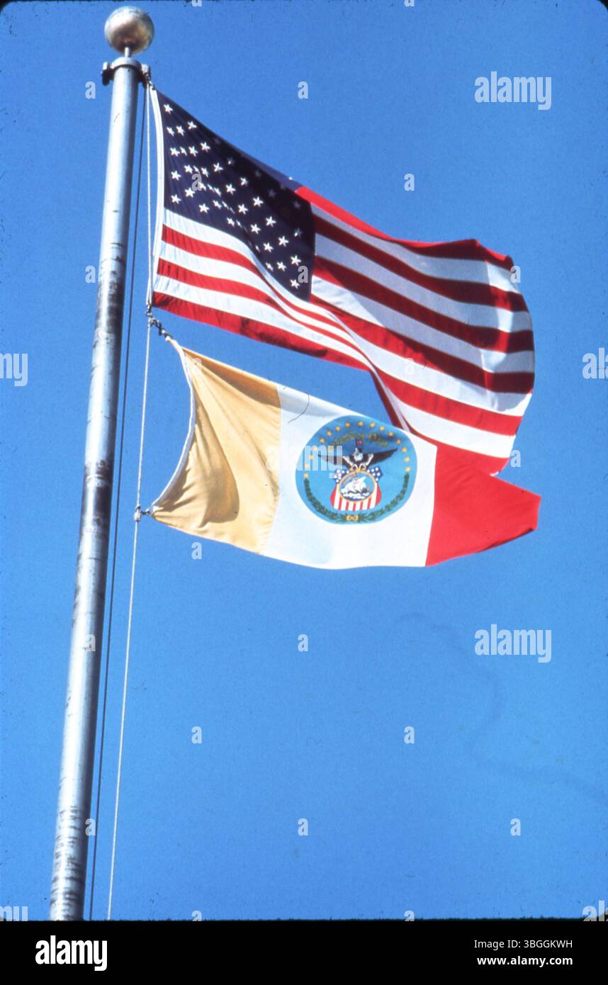 A view of two flags on a flagpole from 1980. The flag of the United ...