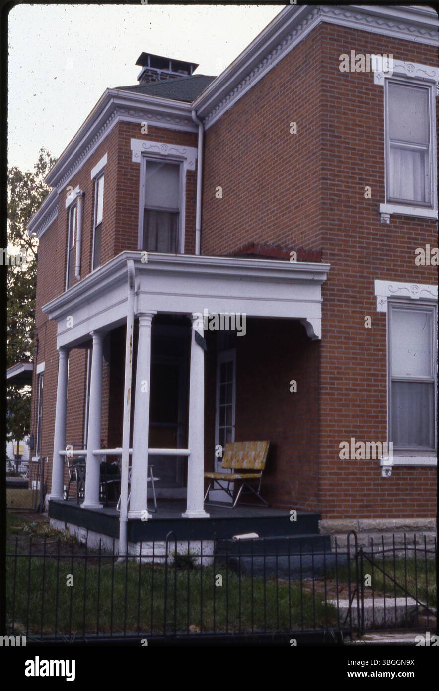 An unidentified two-story brick house featuring decorative lintels and ...