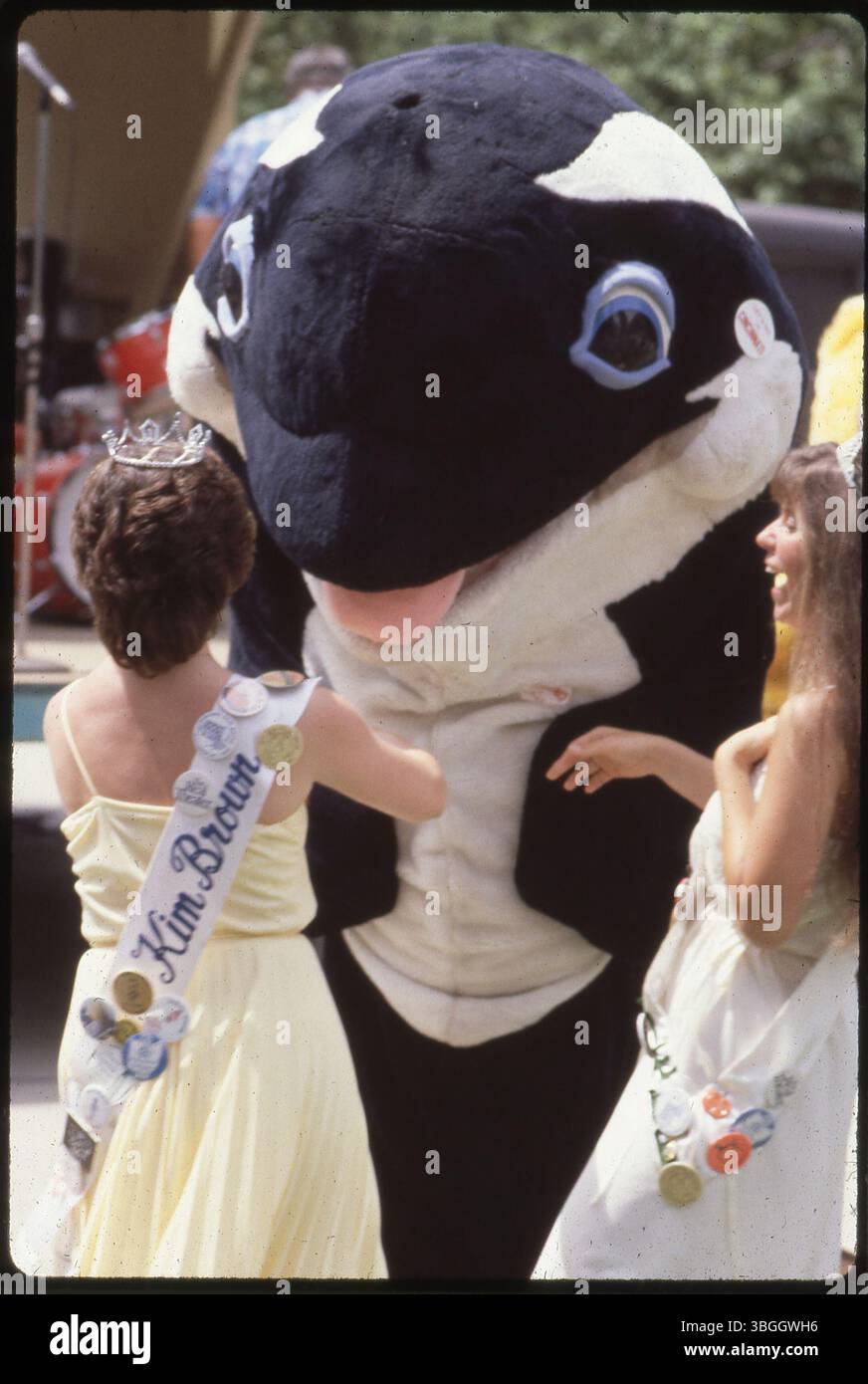 This 1981 image shows a person dressed as a mascot, possibly a whale ...