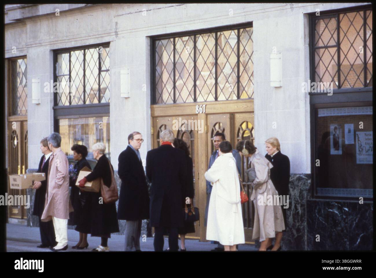 A group of men and women stand outside the King Arts Complex, located ...