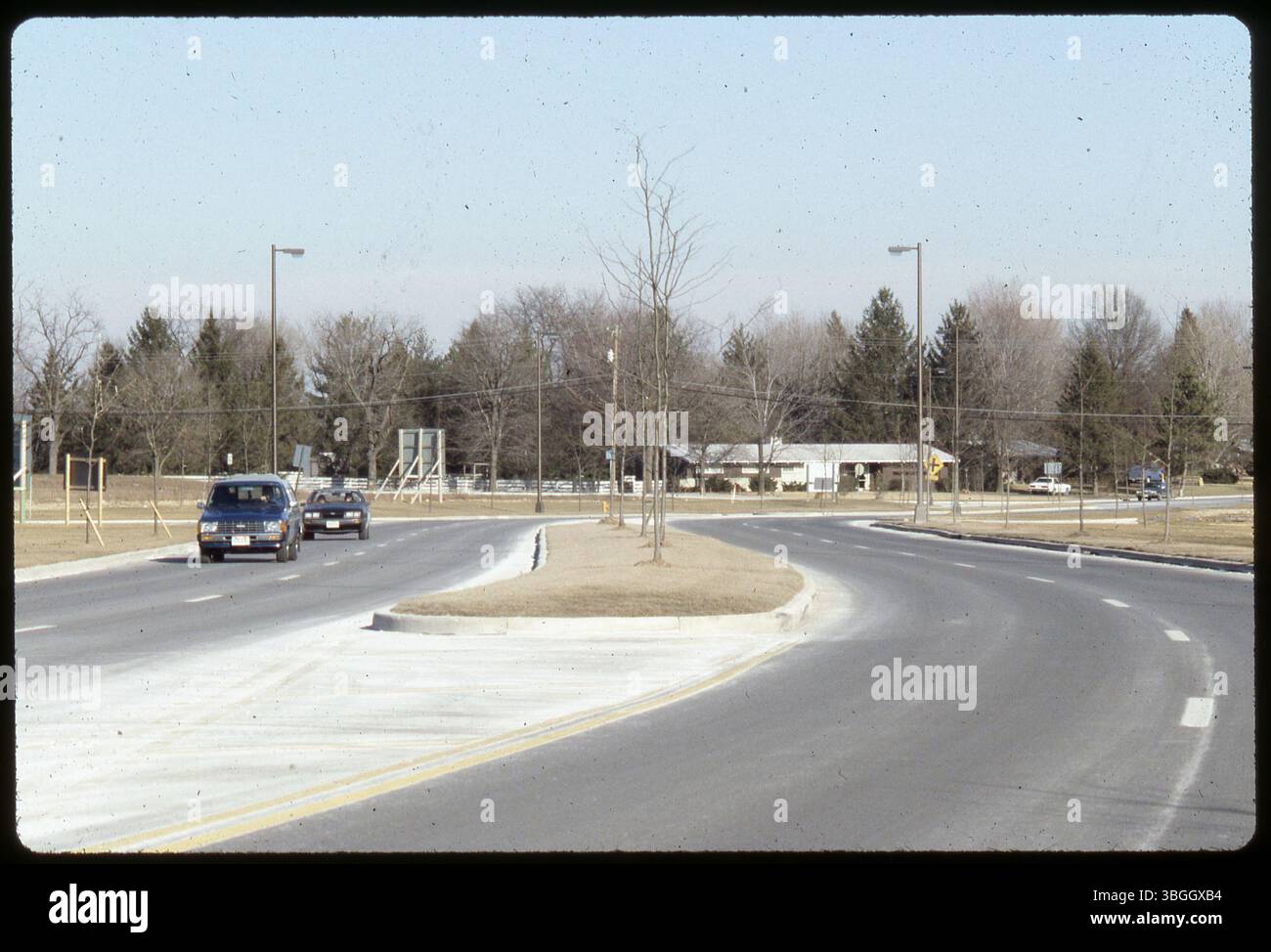 This 1988 photo shows a divided road with two lanes in each direction ...