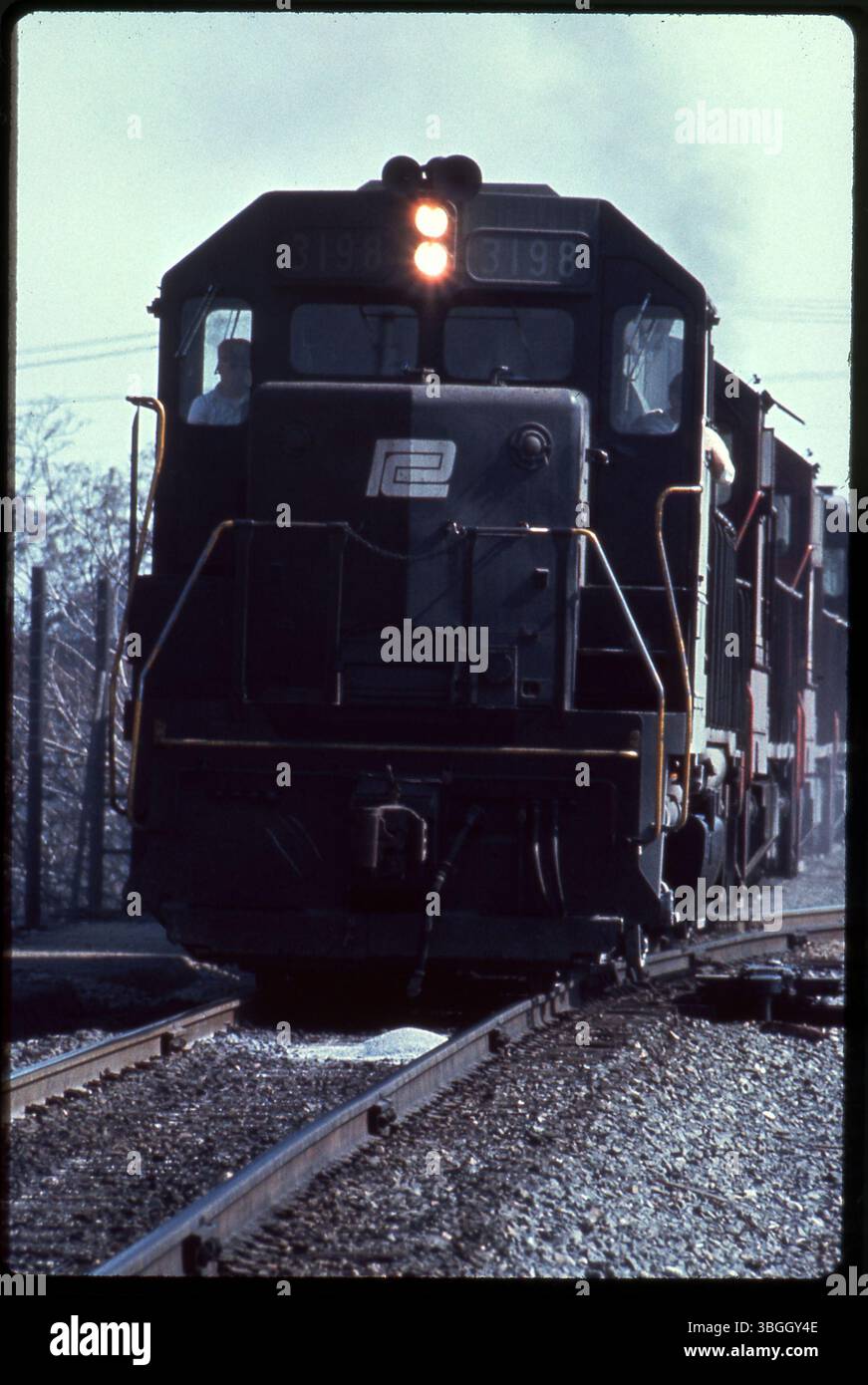 This image shows a Penn Central train, marked with the number 3198 on ...