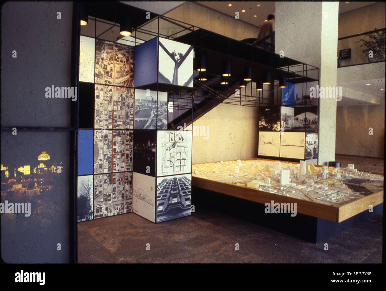 This 1980s image shows an exhibit featuring a 3-D model of the City of ...