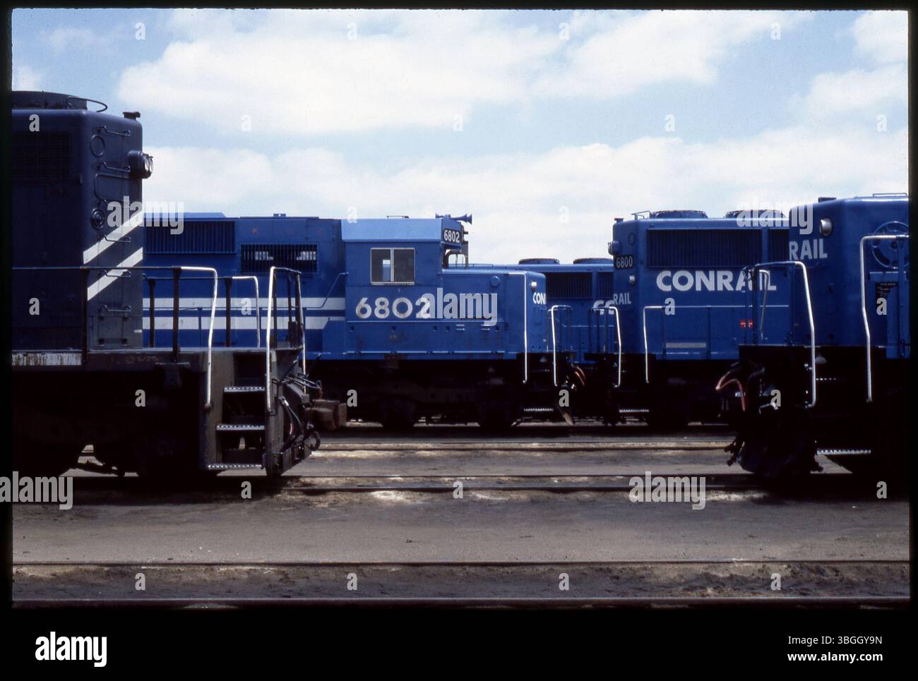 A view of multiple blue Conrail train engines positioned together at an ...
