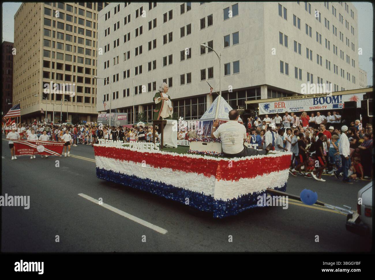 A float featuring a man dressed as Benjamin Franklin, sponsored by Bell ...