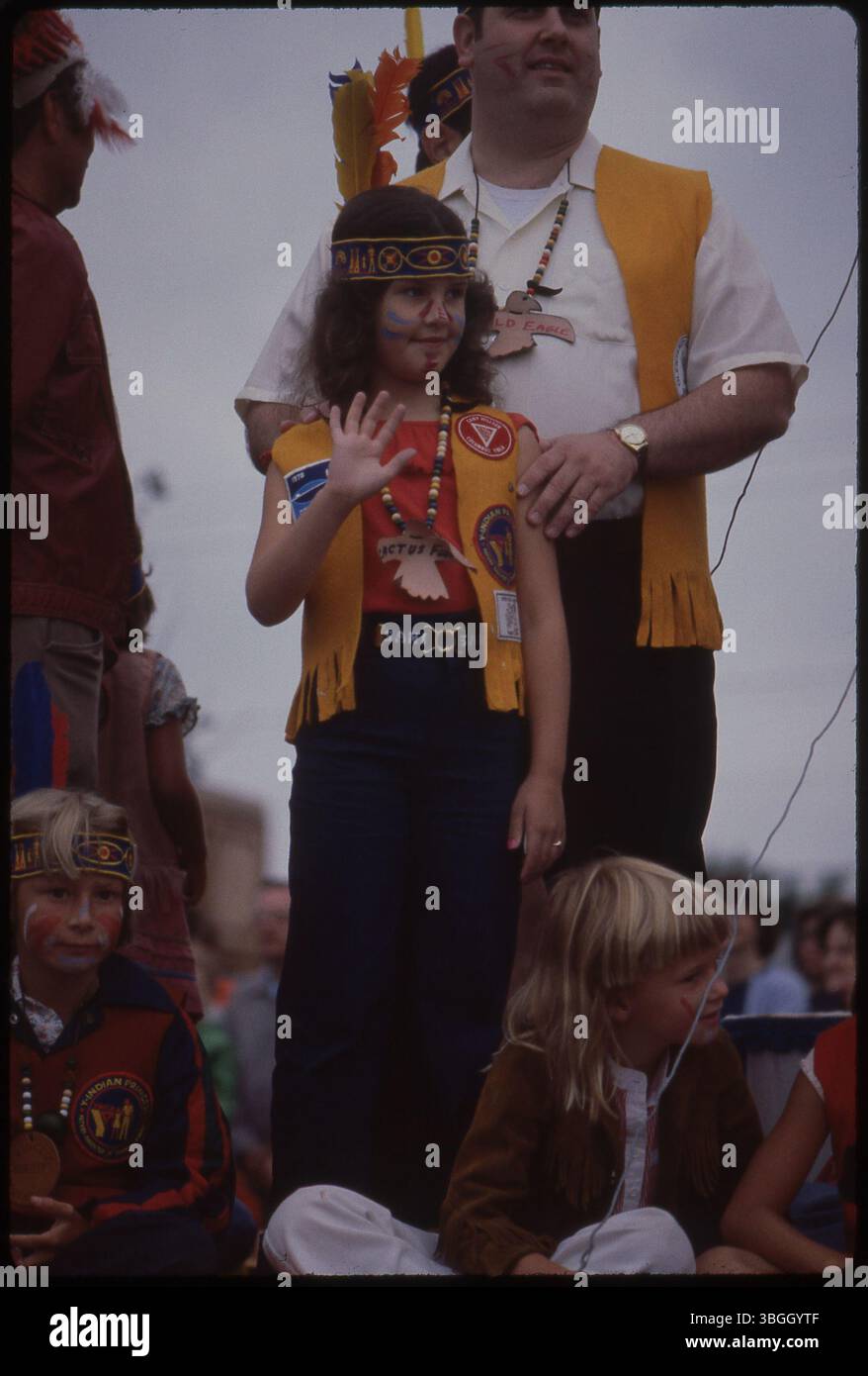 In 1981, a YMCA Camp Willson parade float is seen on a street. A girl ...