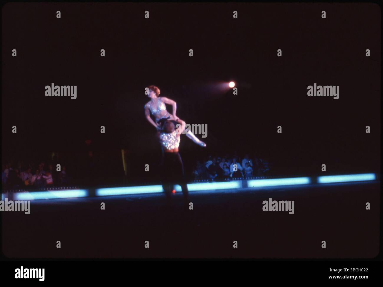 A figure skating pair performs a lift during their routine at the Ice ...