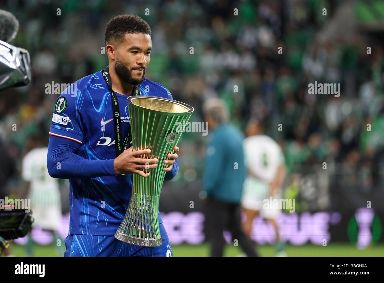 Reece James of Chelsea London holds the trophy at the ceremony after ...