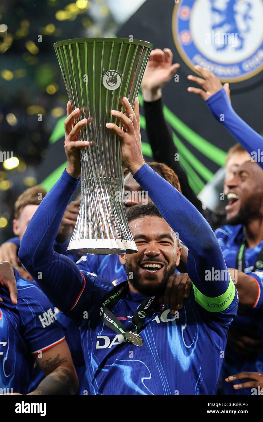 Reece James of Chelsea London holds the trophy at the ceremony after ...