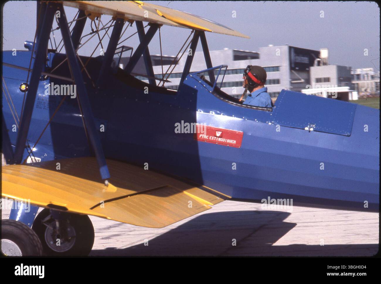 A side view of an open-cockpit biplane, part of the Waco F series ...