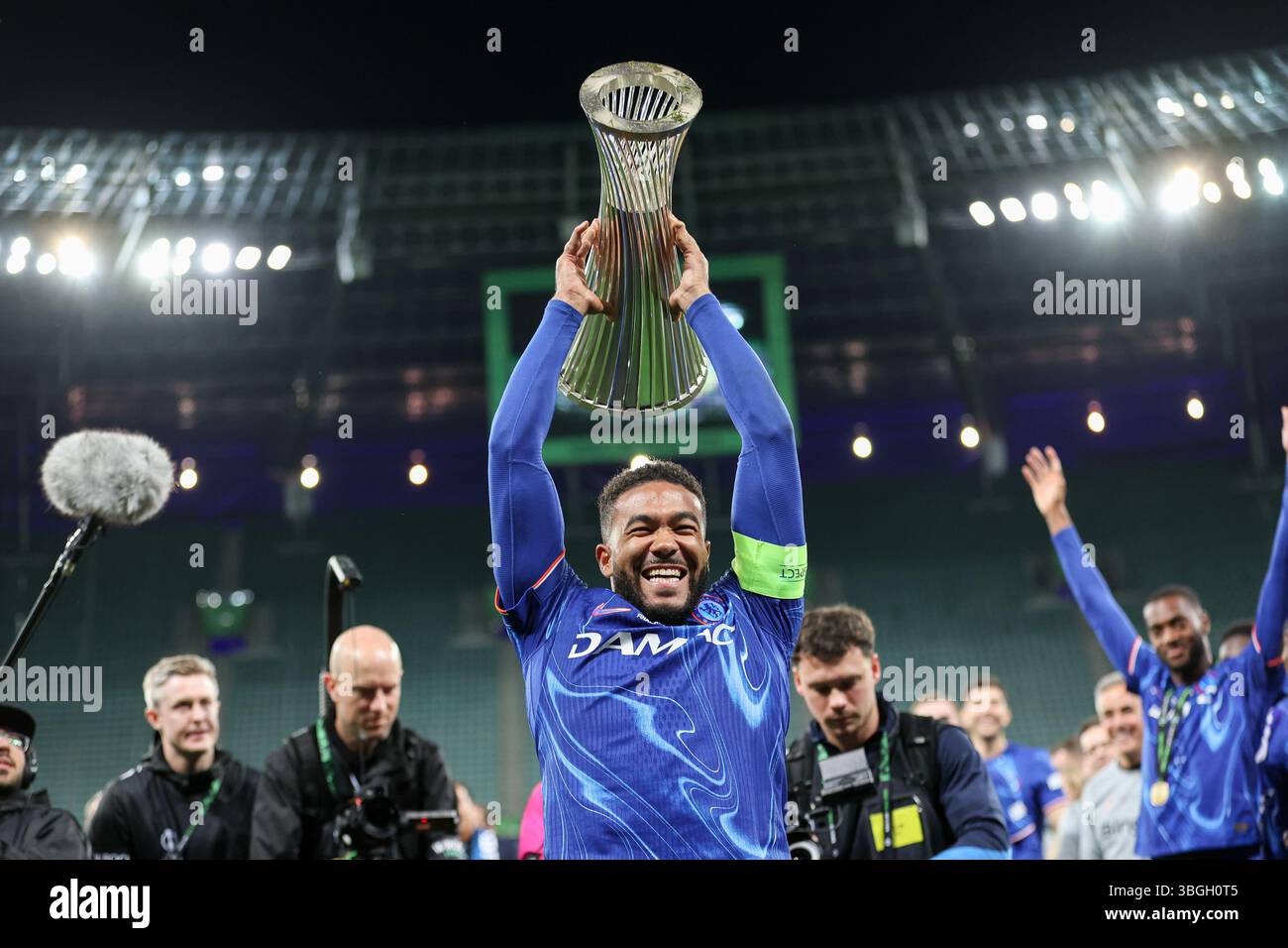 Reece James of Chelsea London holds the trophy at the ceremony after ...