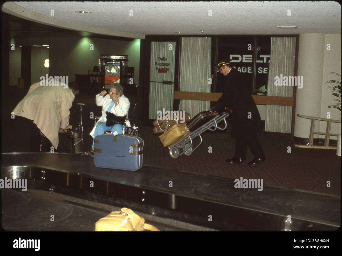 A baggage carousel at Port Columbus Airport shows luggage being ...