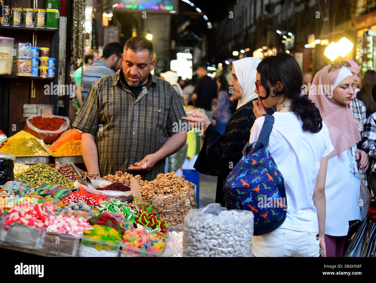 Damascus, Syria. 5th June, 2025. A shopkeeper communicates with ...