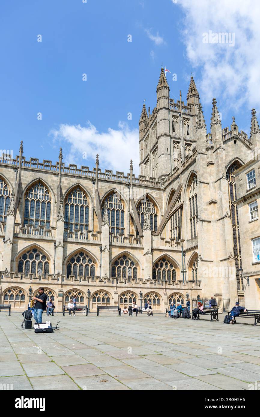 Busker musician performing in Bath Abbey church yard, city of Bath ...