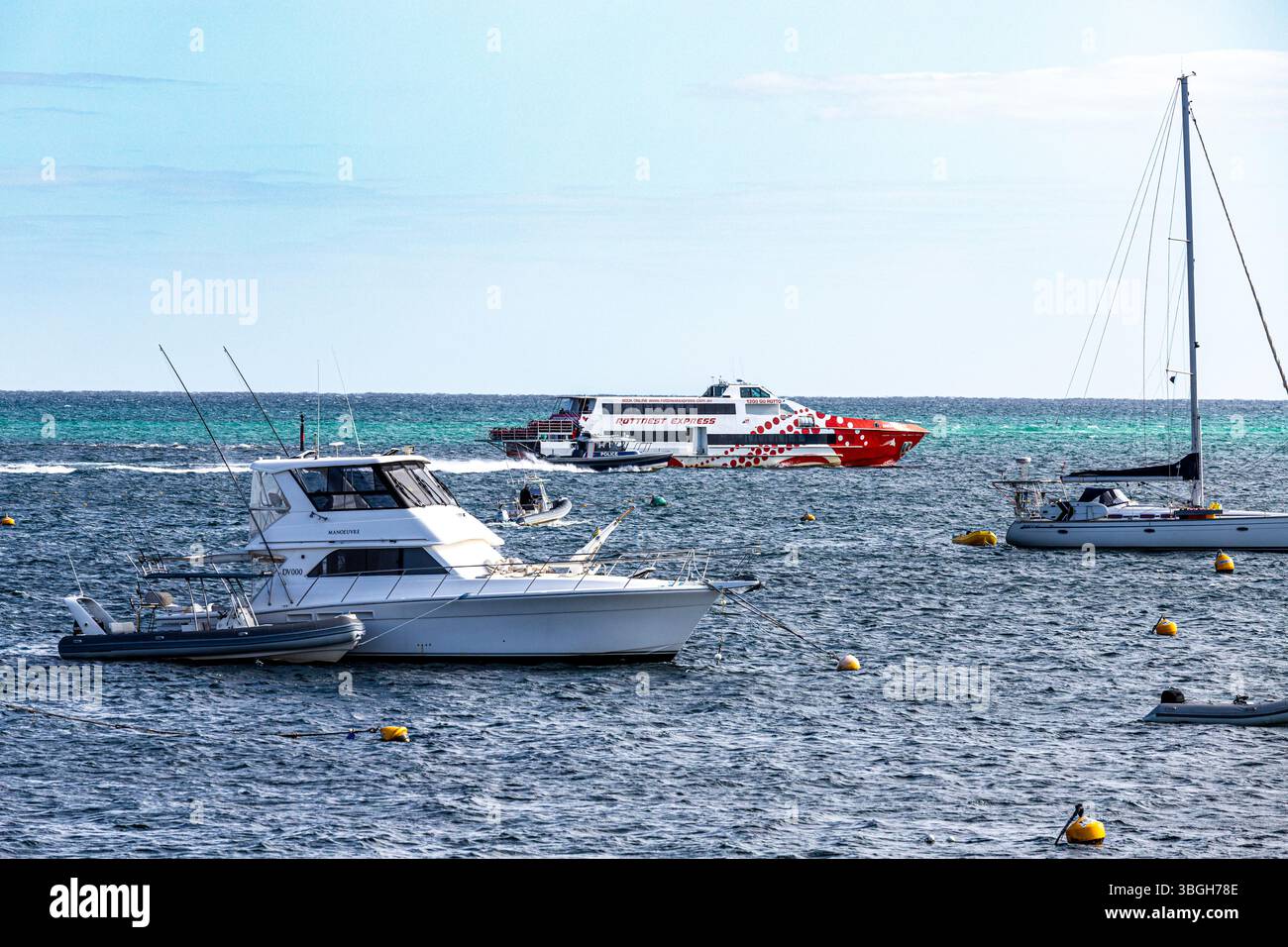 The Rottnest Express ferry and a police launch in Thomson Bay, Rottnest ...