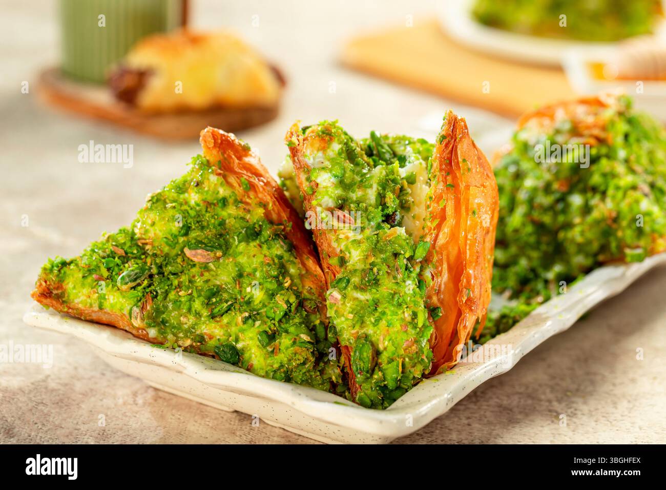 Crispy warbat with cream, honey, and Aleppo pistachio, Arabic Turkish ...