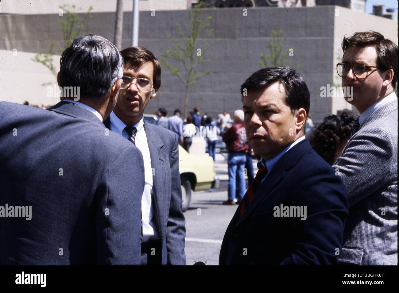 Mayor Dana 'Buck' Rinehart is seen standing with three unidentified men ...