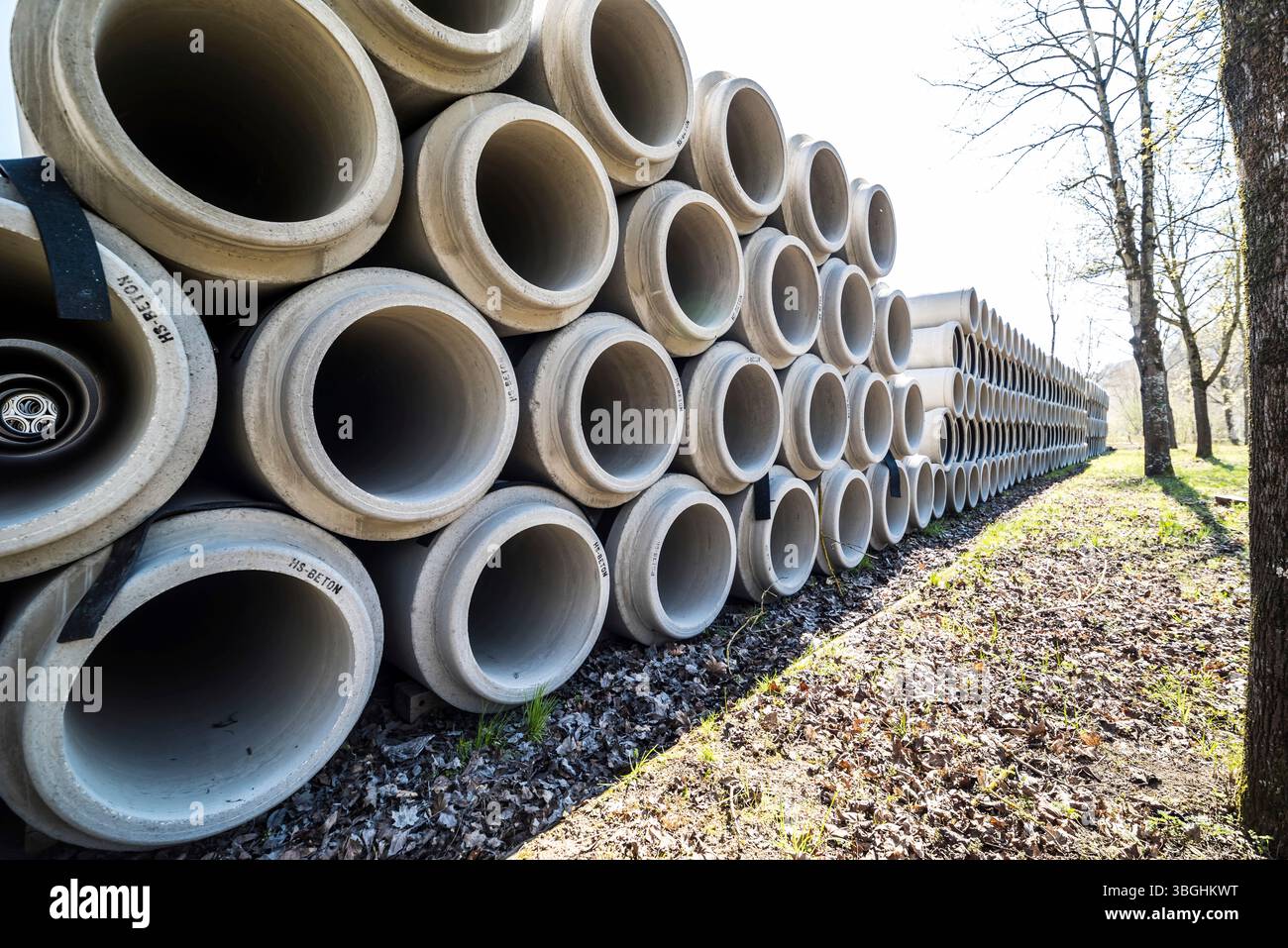 Long stack of concrete pipes with super wide-angle lens Stock Photo - Alamy