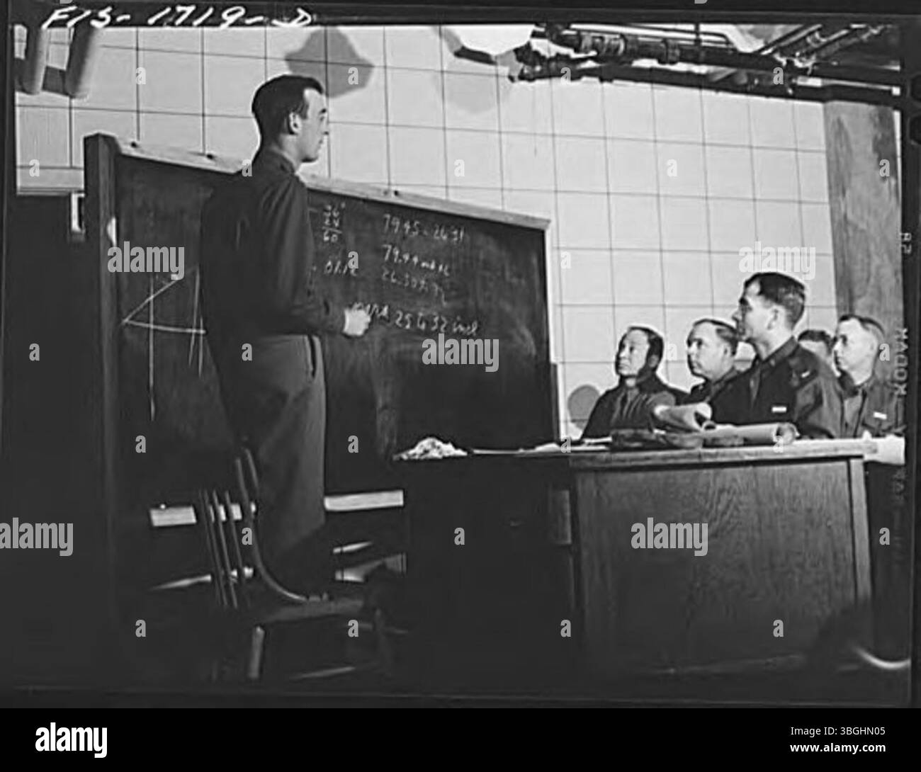 Lieutenant Lawrence Curran instructs a class in map reading at the U.S ...