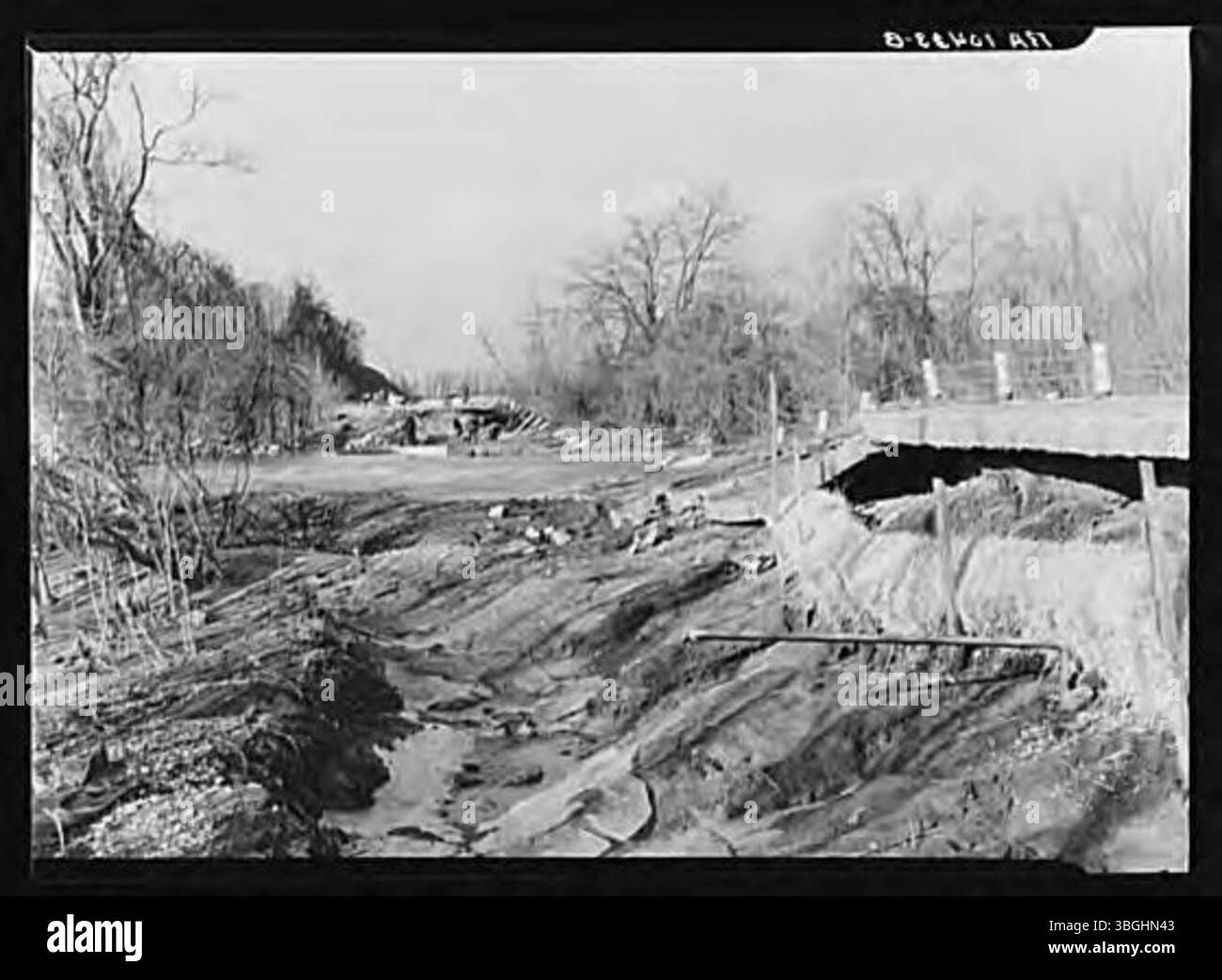 The image documents the damage caused to a state highway and ...