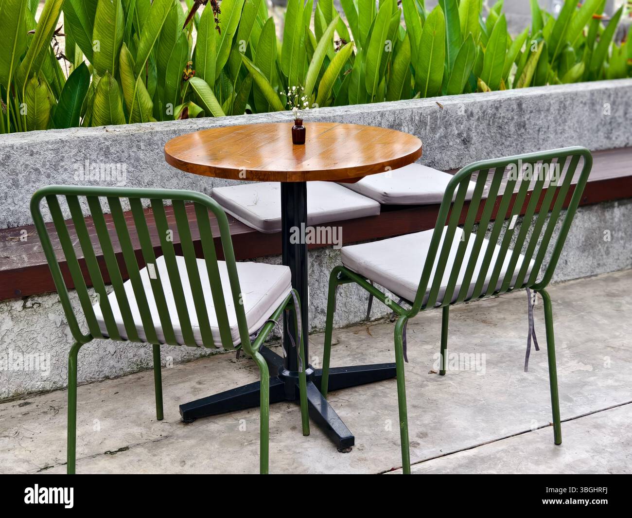 Cozy minimalist outdoor cafe seating by combining metal furniture, a ...