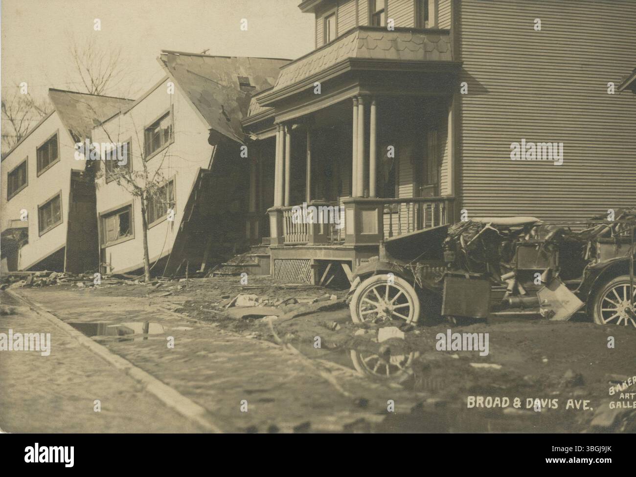 A black-and-white postcard showing two homes destroyed by the 1913 ...