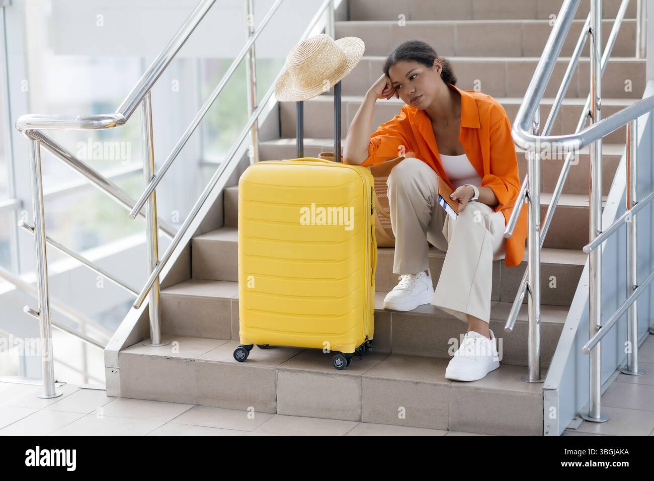 Tired woman sitting airport boarding hi-res stock photography and images - Alamy