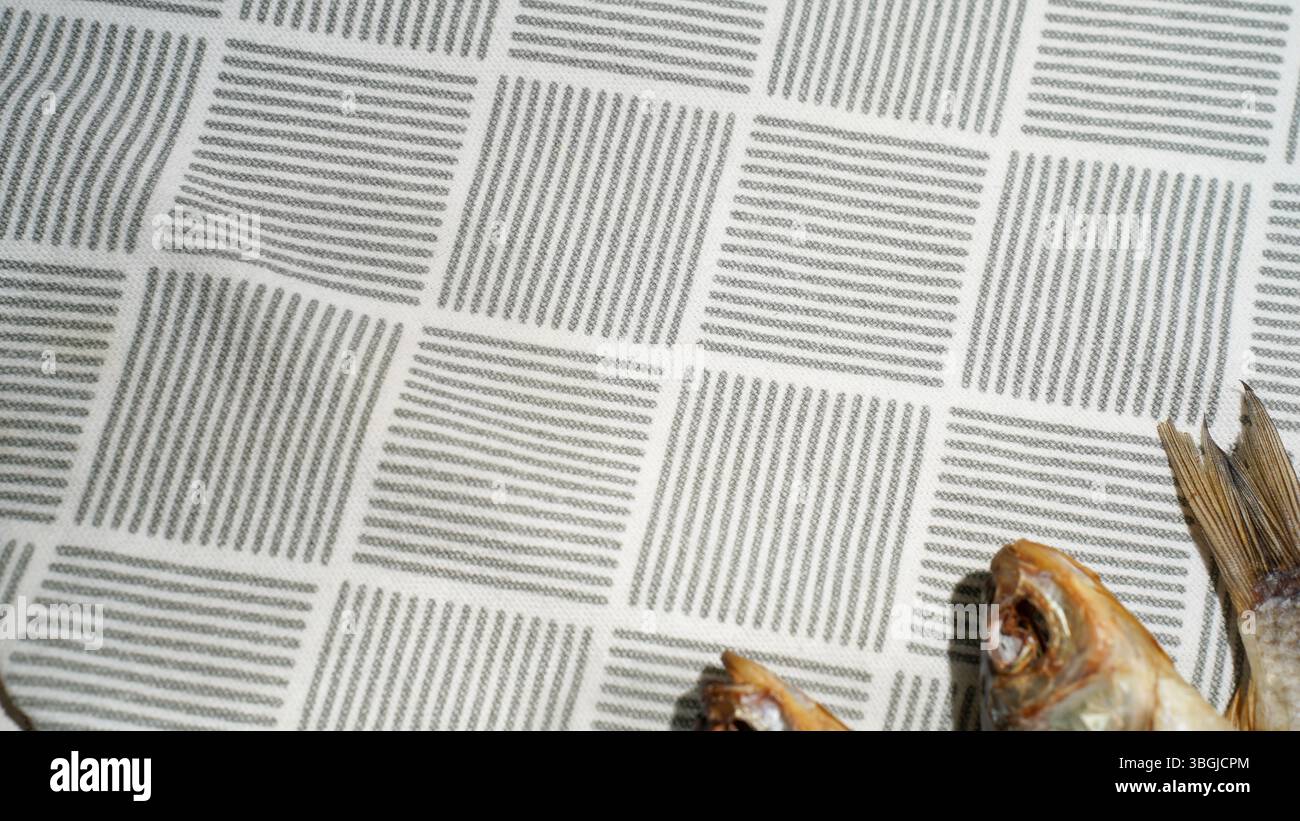Minimalist top-down image showing the corner of dried fish placed on a ...
