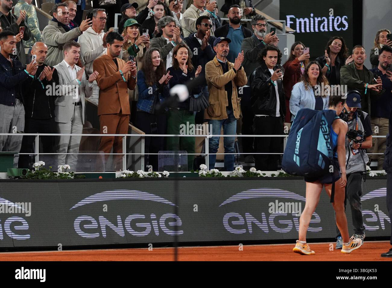 Spectators applaud as France's Lois Boisson leaves the court after the ...