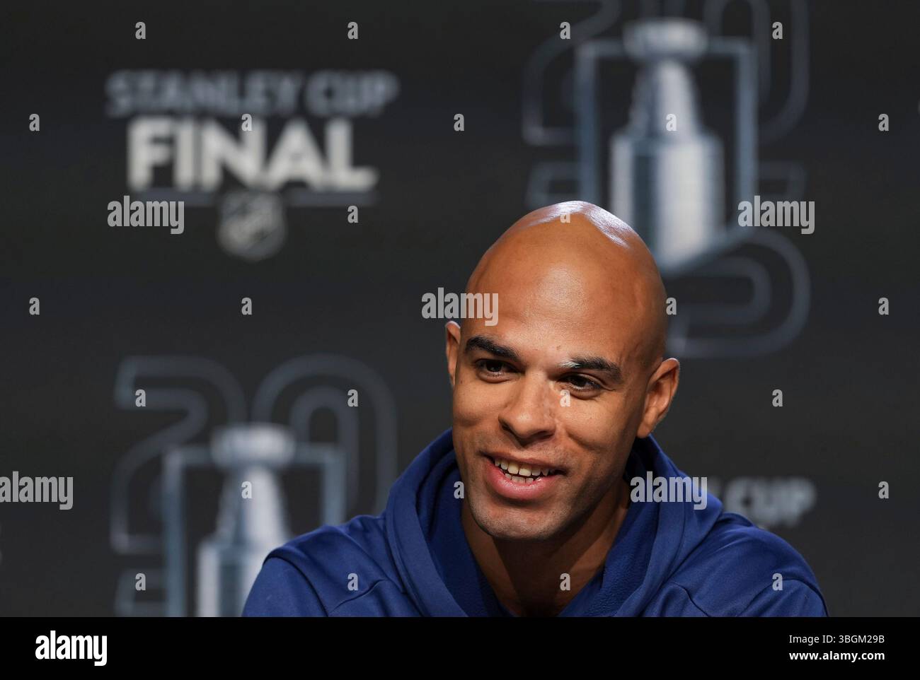 Edmonton Oilers' Darnell Nurse smiles while responding to a question ...