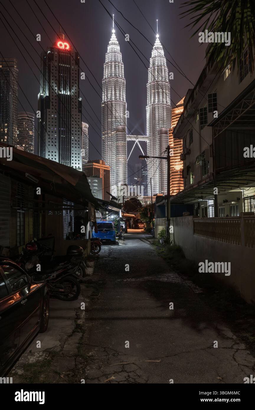 Petronas Towers night views from old Kuala Lumpur alleys Stock Photo ...