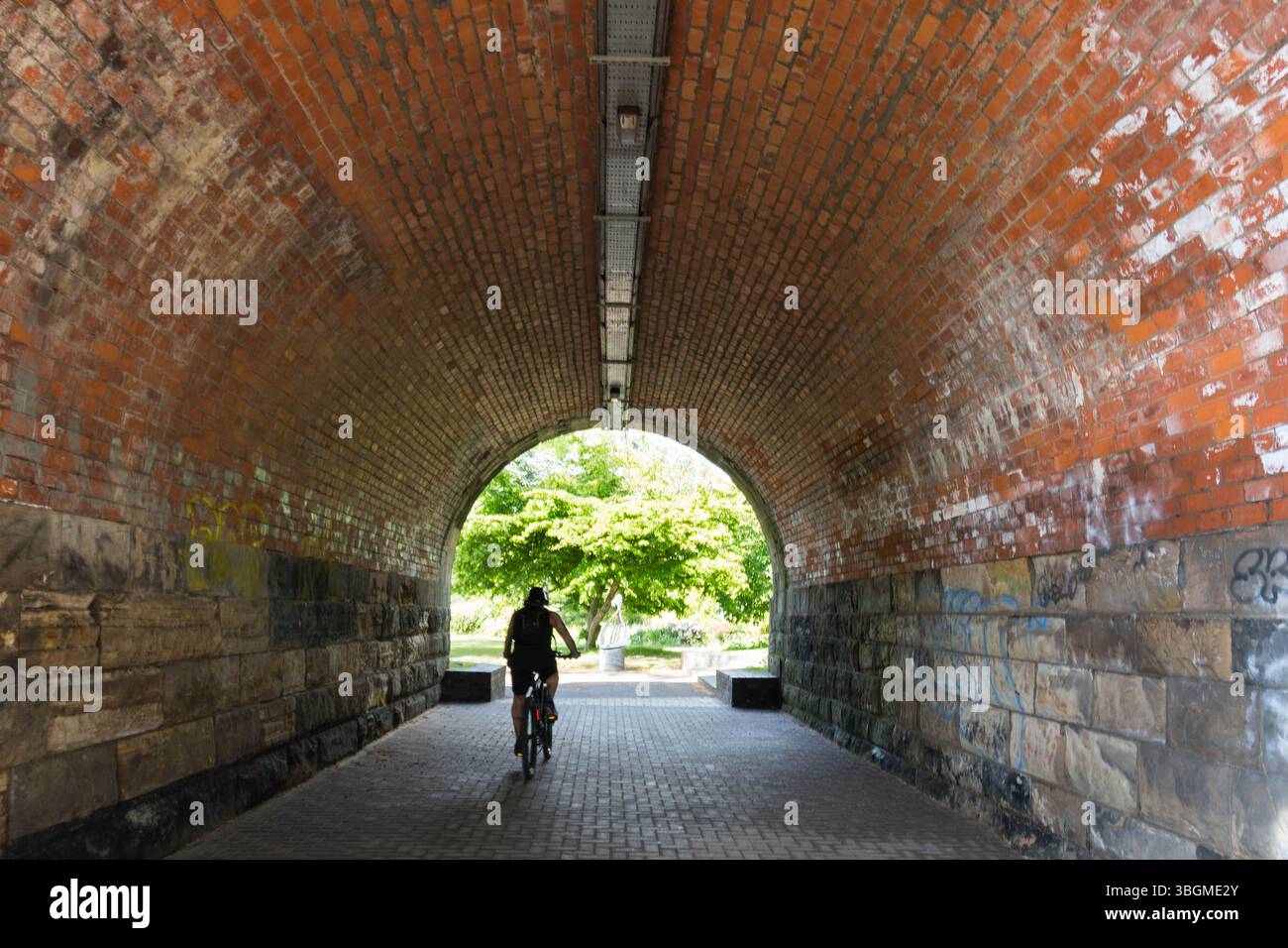 Pedestrian tunnel with cyclist in Rodney Gardens, Perth, Scotland Stock ...