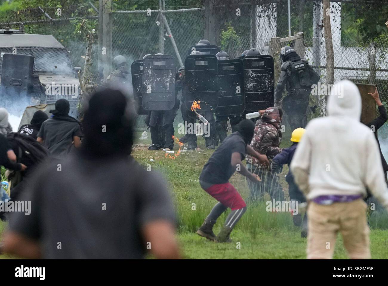 Demonstrators clash with police during protests against President Jose ...