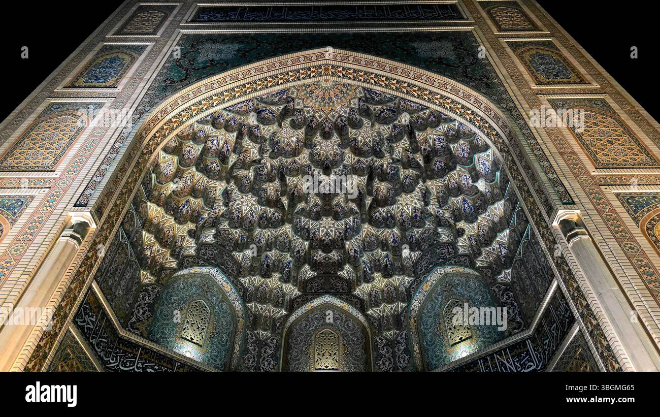 The illuminated exterior entrance of sultan qaboos grand mosque in ...