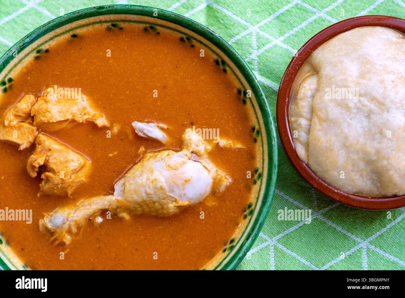 Light soup with chicken and fufu, West African soup dish, served in ...