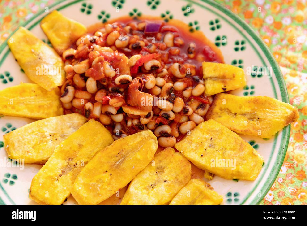 Red Red West African dish with fried plantains and black-eyed beans in ...