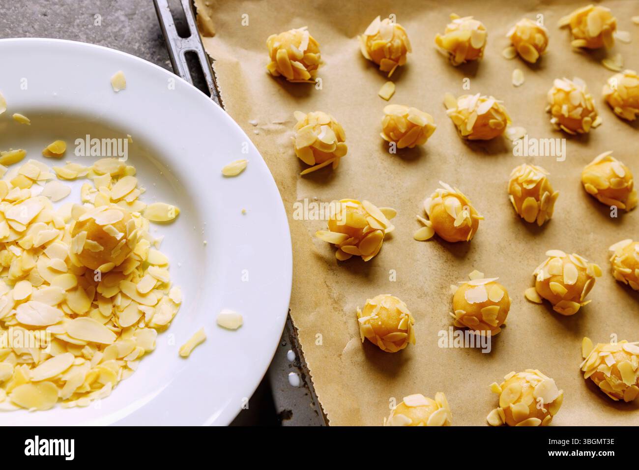 Sicilian almond cookies during preparation, marzipan and almond dough ...