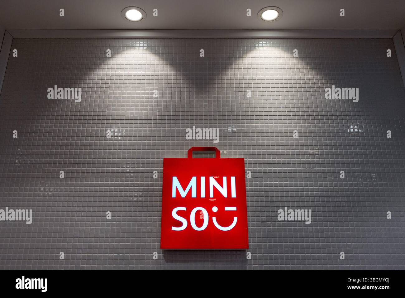 The signboard MINISO store. Miniso brand logo. Miniso signage on the ...