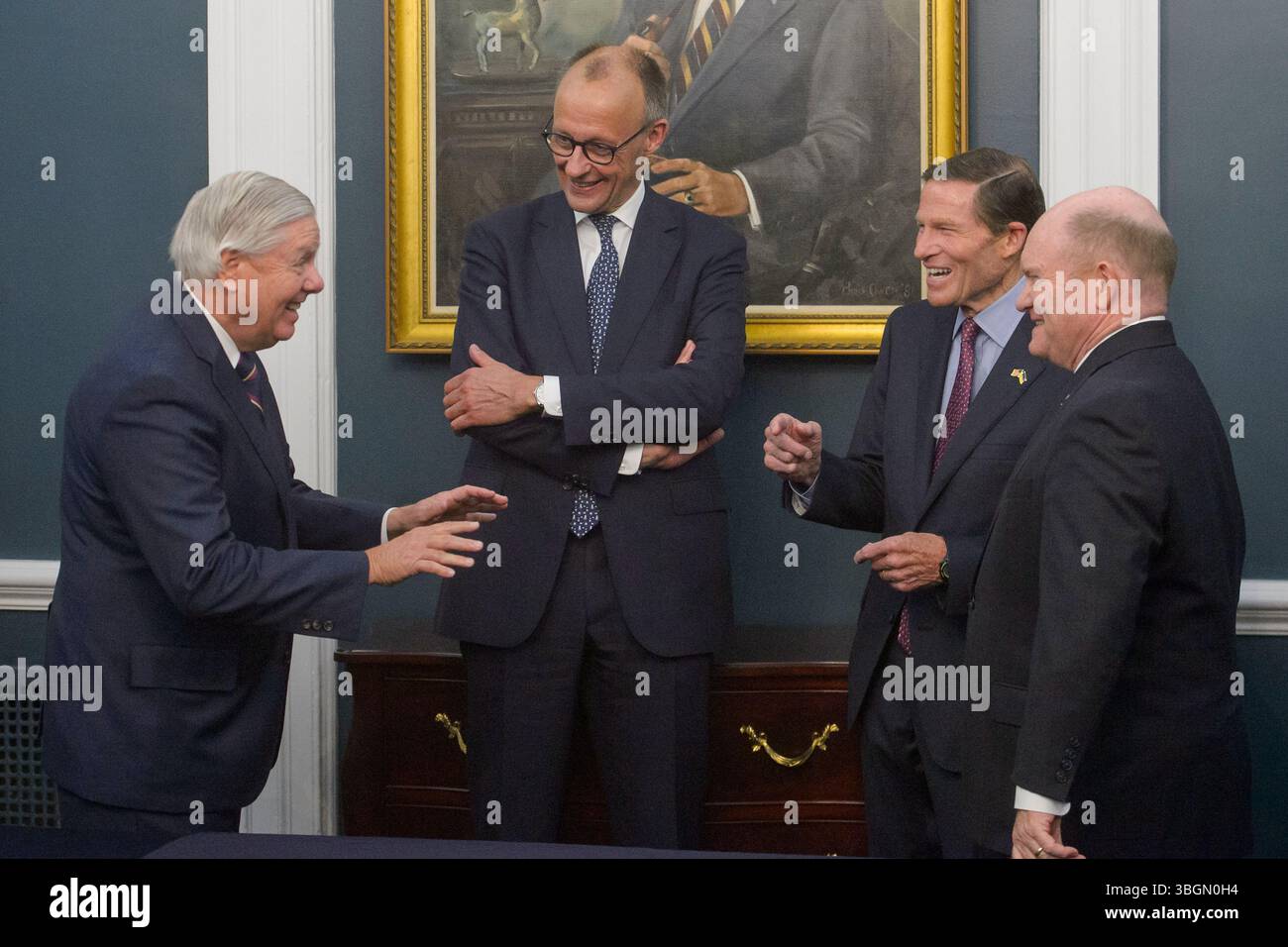 German Chancellor Friedrich Merz, second from left, talks with, from ...